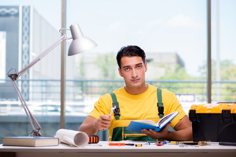 The Construction Worker Sitting at the Desk Stock Photo - Image of ...