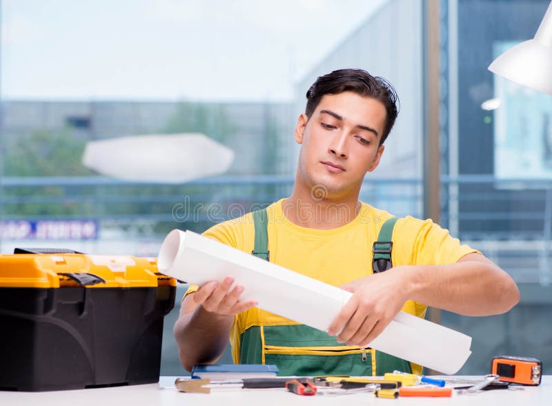 Construction Worker Sitting at the Desk Stock Image - Image of male ...