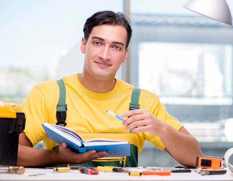 Construction Worker Sitting at the Desk Stock Image - Image of ...