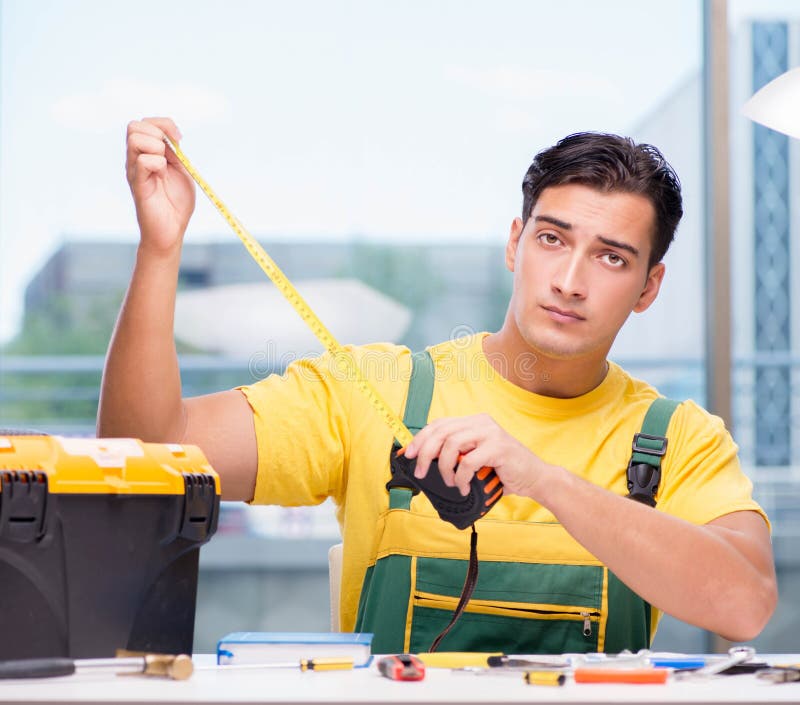Construction Worker Sitting at the Desk Stock Image - Image of plumbing ...