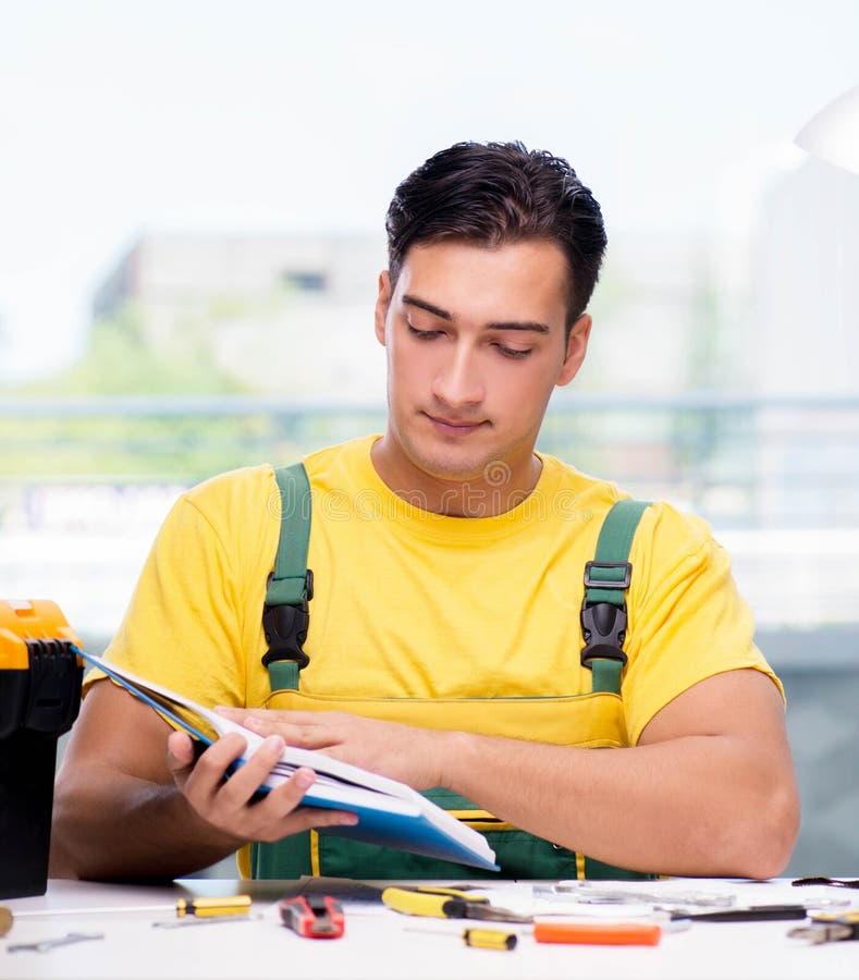 Construction Worker Sitting at the Desk Stock Image - Image of office ...