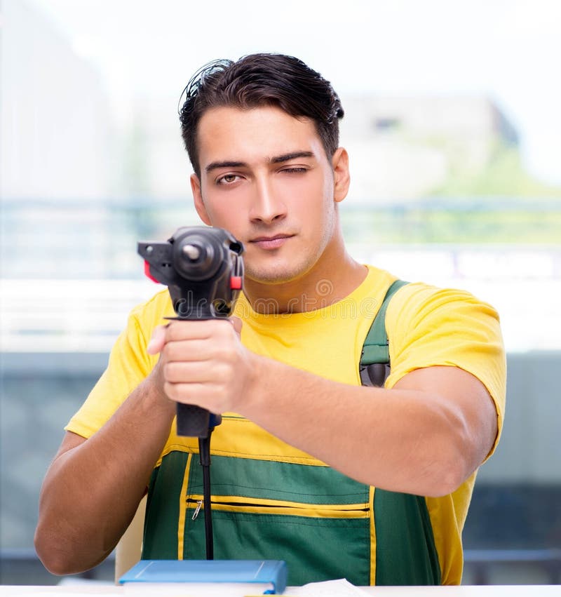 Construction Worker Sitting at the Desk Stock Photo - Image of helmet ...