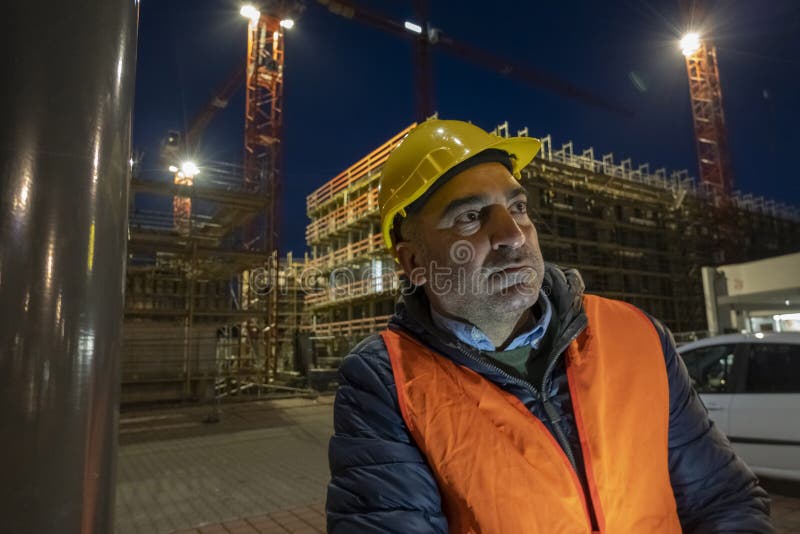 Construction Worker at Night Stock Photo - Image of hard, occupational ...
