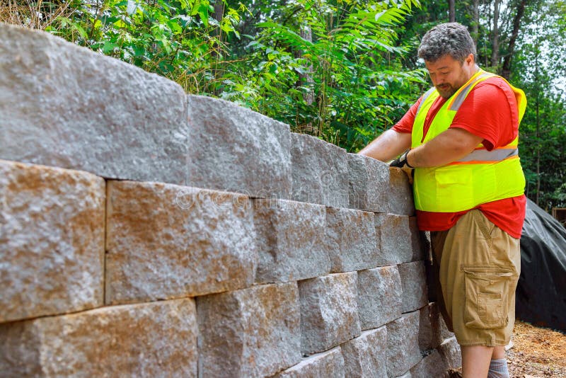 Construction Worker is Currently Working on Building Retaining Wall ...