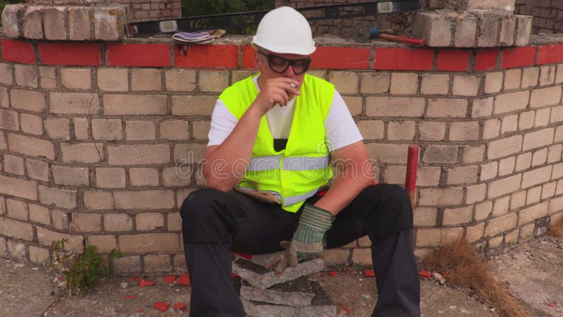 Construction Worker Smoking Near Unfinished Building Stock Video ...