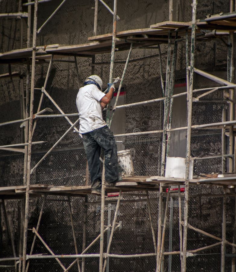 Construction Workers Spraying Stucco on the Exterior of a Building ...