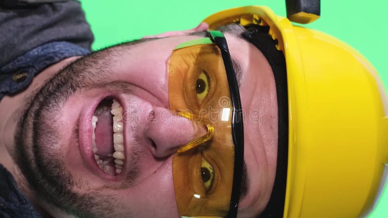 Construction Worker Strikes with a Hammer Using a Hand-held Metal Tool ...