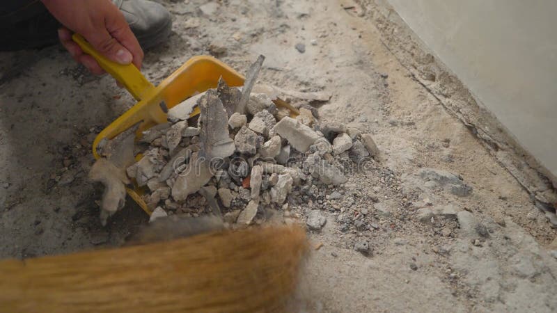 Construction Worker Sweeping Debris with Broom and Dustpan Stock ...