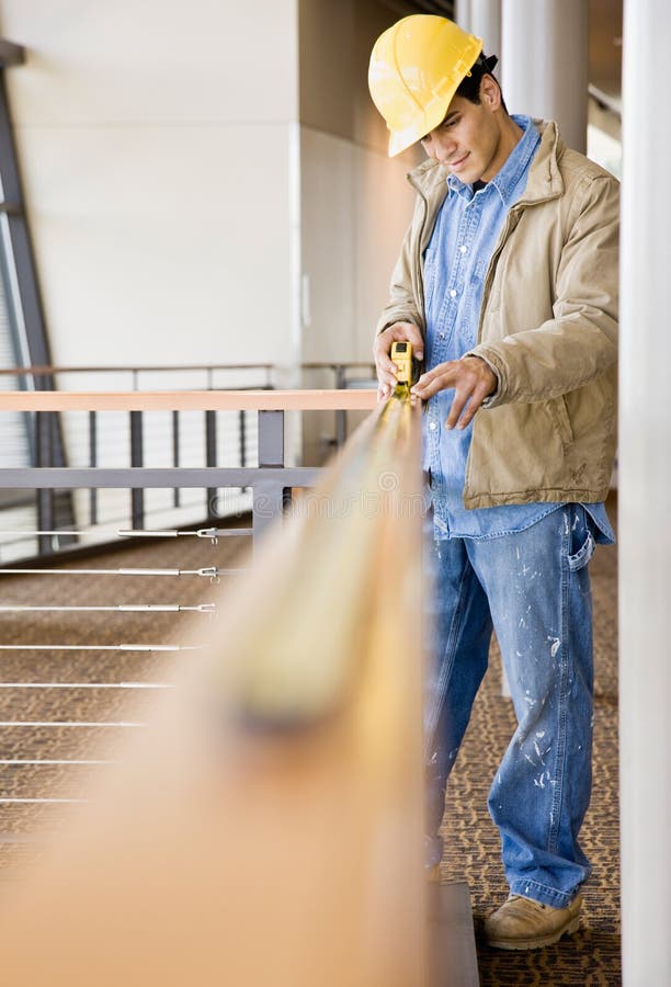Construction Worker Taking Measurement Stock Photo - Image of skill ...