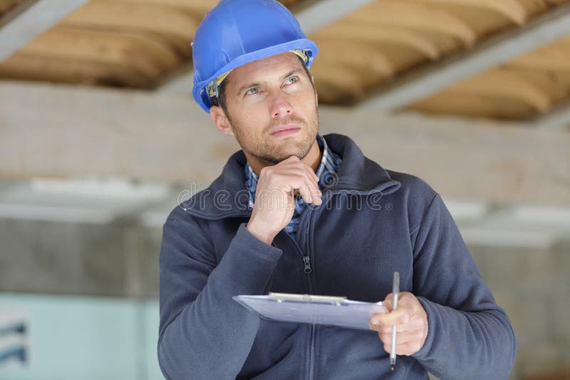 Construction Worker Taking Notes Stock Photo - Image of indoor ...