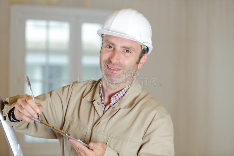 Construction Worker Taking Notes on Clipboard Stock Image - Image of ...