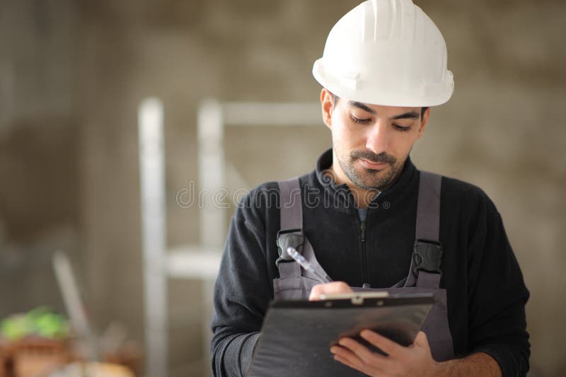 Construction Worker Taking Notes on Clipboard Stock Image - Image of ...