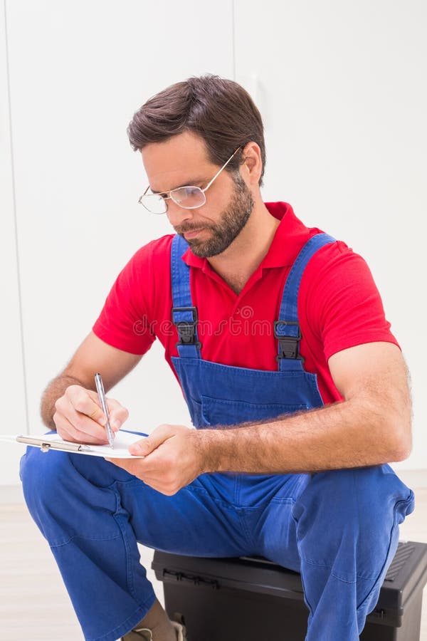Construction Worker Taking Notes on Clipboard Stock Image - Image of ...