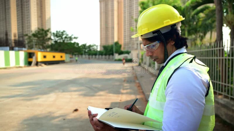Construction Worker Taking Notes at a Construction Site Stock Video ...