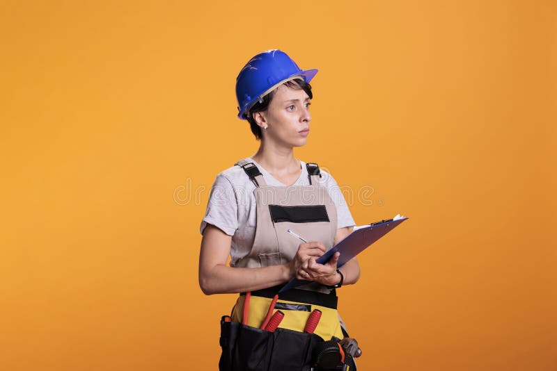 Construction Worker Taking Notes and Measurements Stock Photo - Image ...