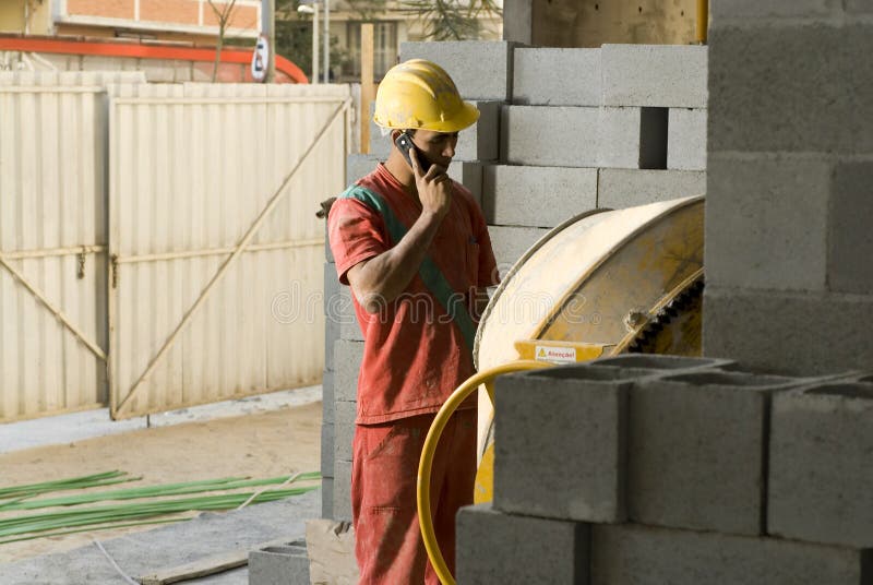 Construction Worker on a Cell Phone Stock Photo - Image of door ...