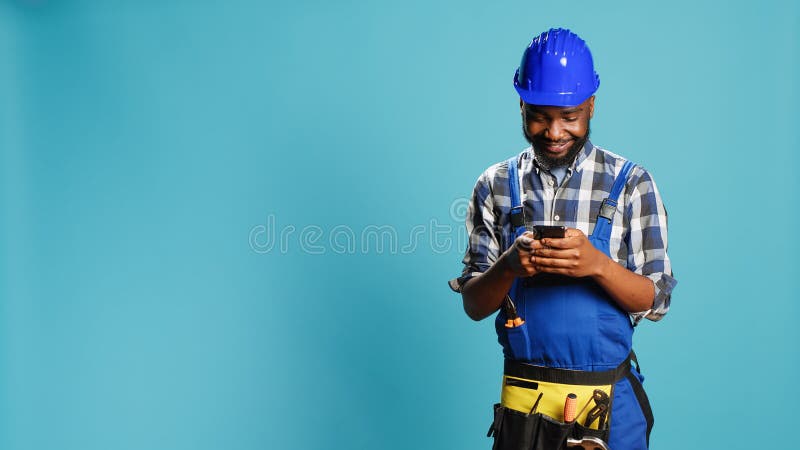 Construction Worker Texting Messages on Smartphone Stock Image - Image ...