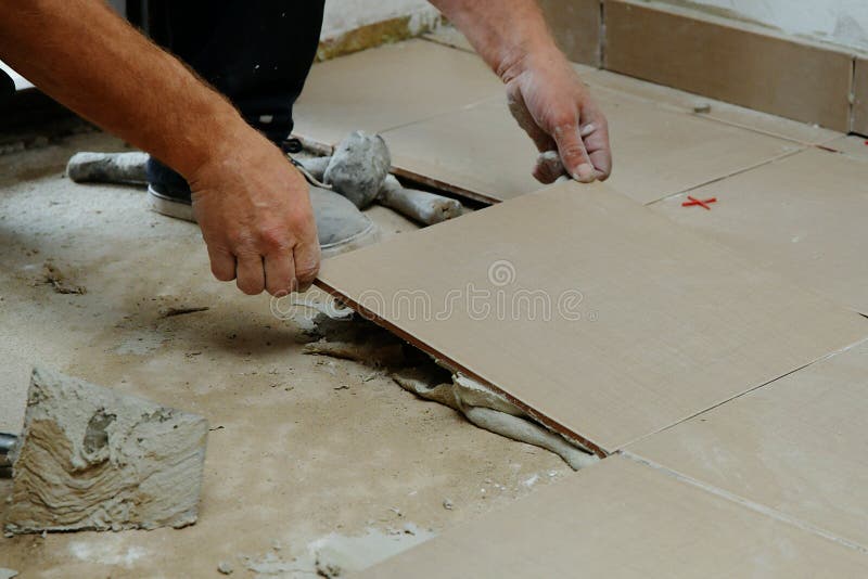 Man Laying Ceramic Floor Tiles Stock Image - Image of tool, flooring ...