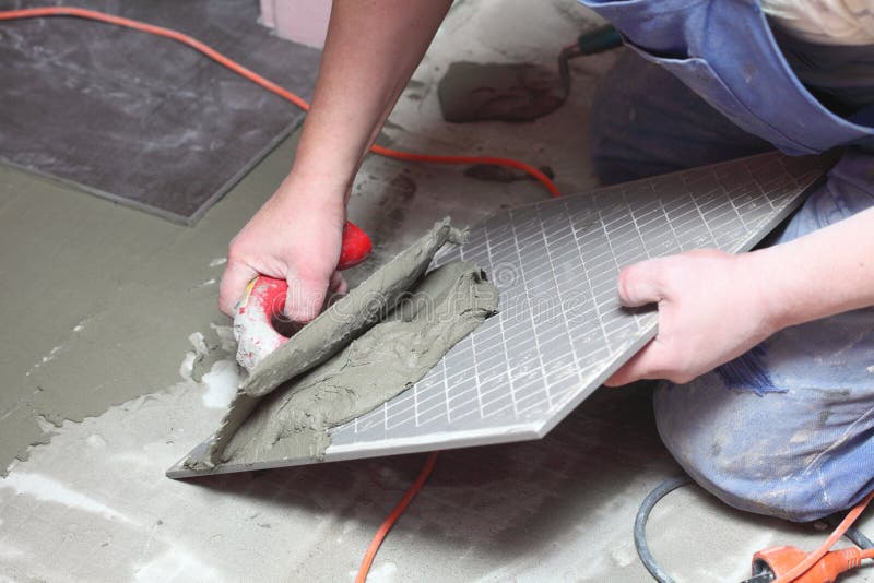 Construction Worker is Tiling at Home Tile Floor Adhesive Stock Image ...