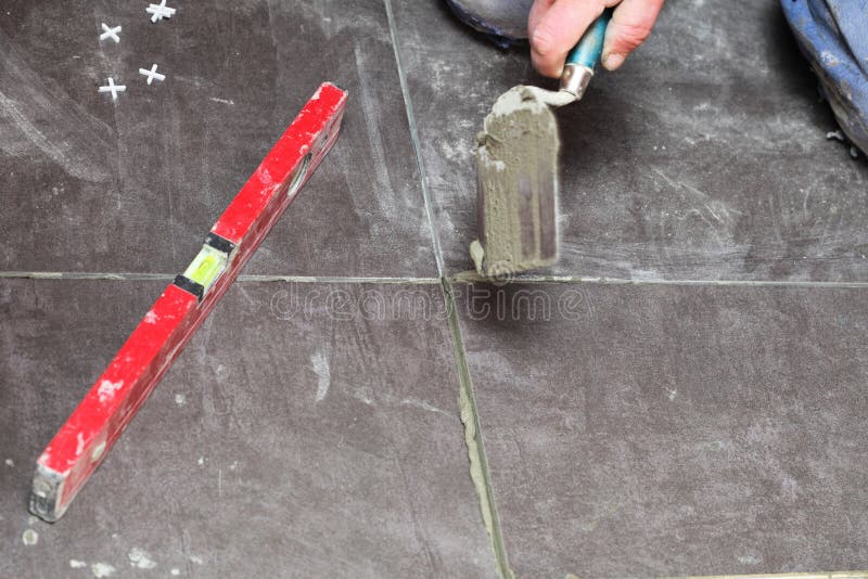 Construction Worker is Tiling at Home Tile Floor Adhesive Stock Photo ...