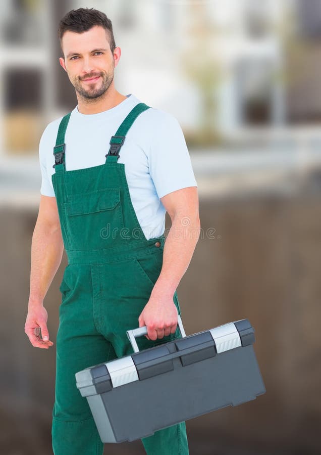 Construction Worker with Tool Box in Front of Construction Site Stock ...