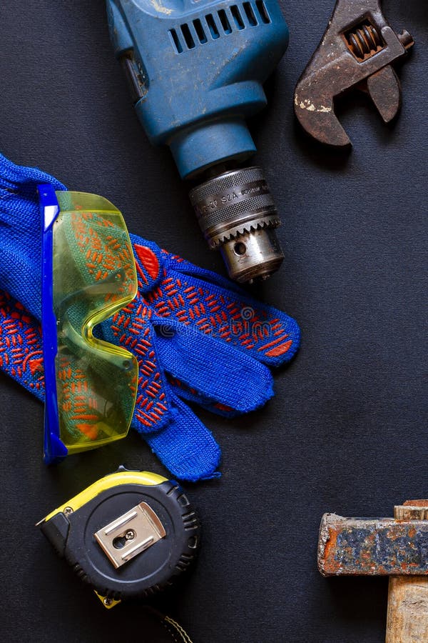 Construction Worker Tools on a Dark Background Top View Stock Image ...
