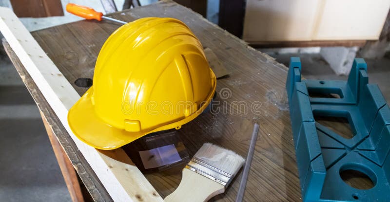 Construction Worker Tools and a Hard Hat on a Wooden Table Stock Photo ...