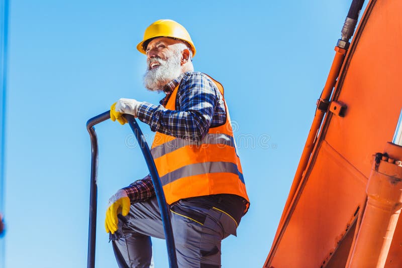 Worker in Reflective Vest and Hardhat Standing on Top of Stock Image ...