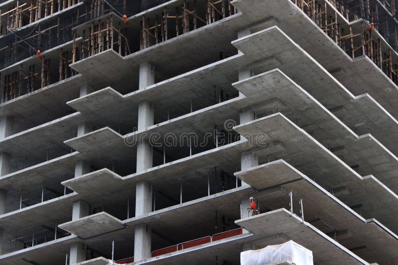 Construction Worker on Unfinished High-rise Building Stock Photo ...