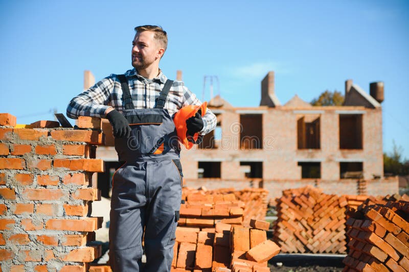 Construction Worker in Uniform and Safety Equipment Have Job on ...