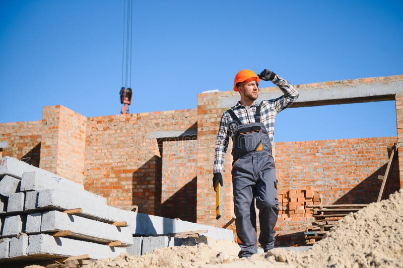 Construction Worker in Uniform and Safety Equipment Have Job on ...