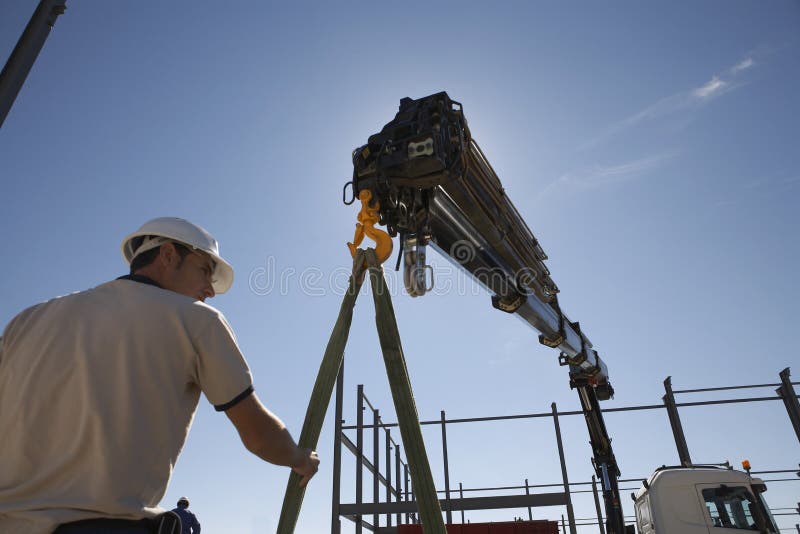 Construction Worker Unloading Material from Truck Stock Photo - Image ...