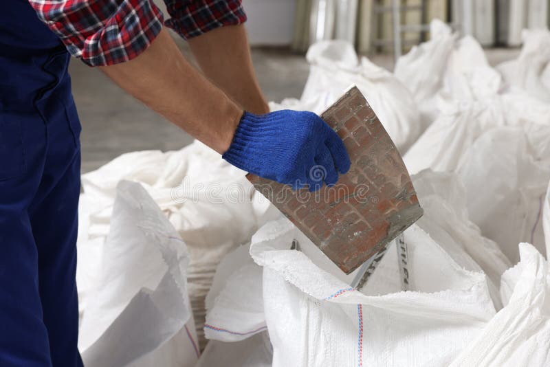 Construction Worker with Used Building Materials in Room Prepared for ...