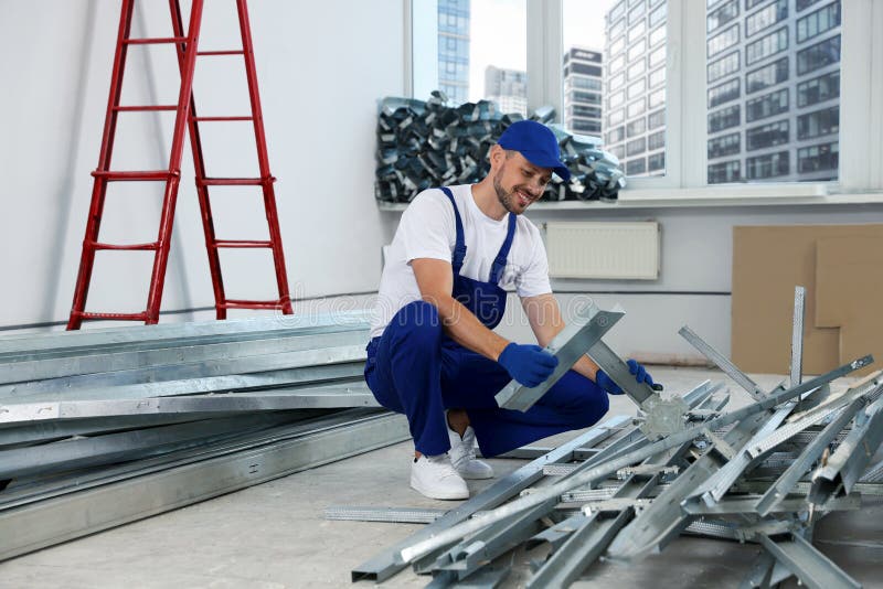 Construction Worker with Used Building Materials in Room Prepared for ...