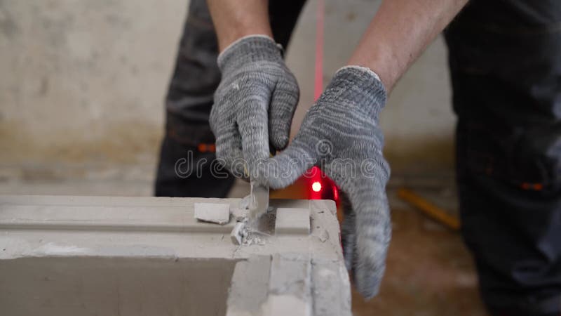 Skilled Worker Using Laser Level and Measuring Tools on Construction ...