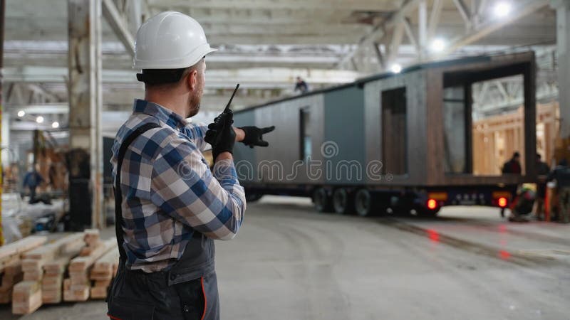 Construction Worker Directing Modular Home Loading Process Stock ...