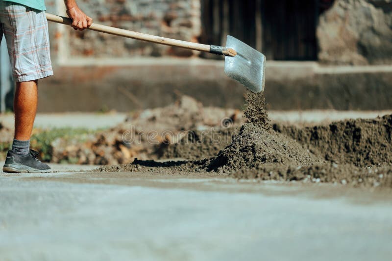 Construction Worker Uses a Shovel To Dig a Ditch Stock Image - Image of ...