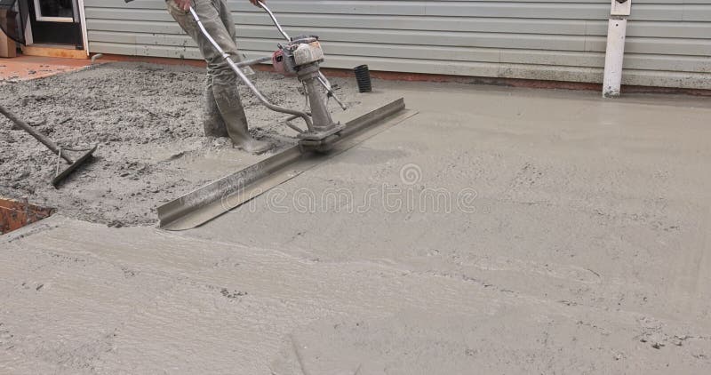 Construction Worker Uses a Special Tool To Level Concrete Stock Video ...