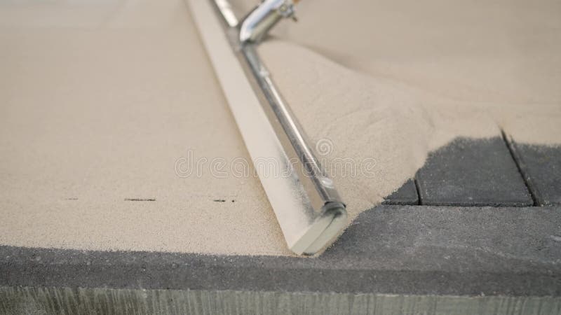 Construction Worker Spreading Sand on Paving Stones Stock Video - Video ...
