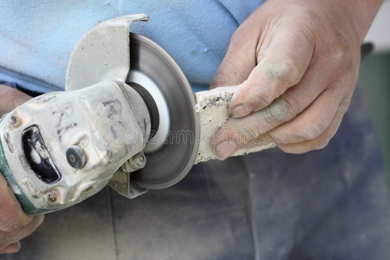 Construction Worker Using an Angle Grinder Cutting Tile Stock Image ...