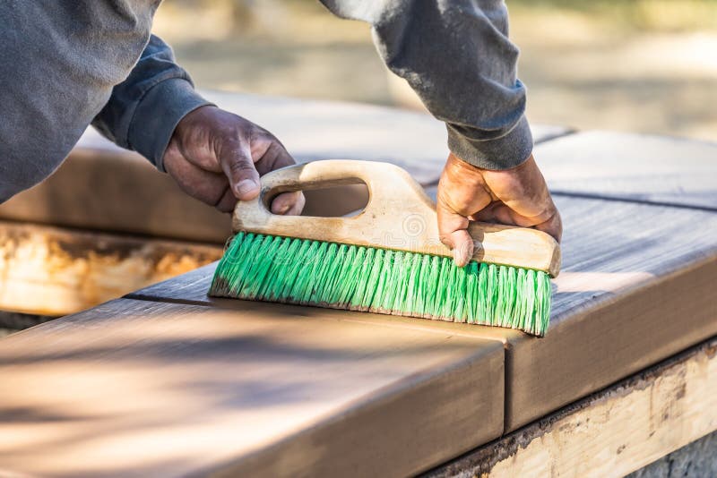 Construction Worker Using Brush on Wet Cement Forming Coping Around New ...
