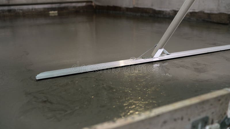 Construction Worker Leveling Concrete Slab with Bull Float Stock Photo ...