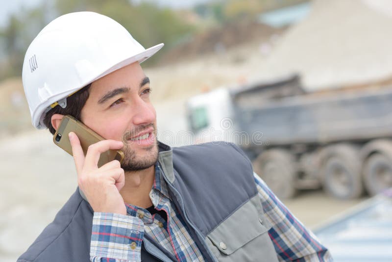 Construction Worker Using Cell Phone Stock Photo - Image of cell ...