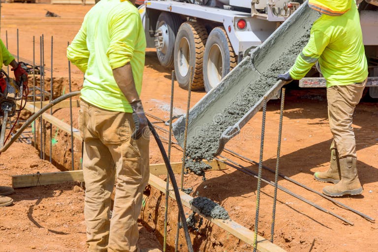 Construction Worker Using Concrete Vibrator for Compacting Cement at ...