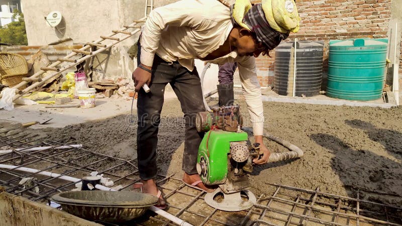 12-1-24 Construction Worker Using Concrete Vibrator for Compacting ...