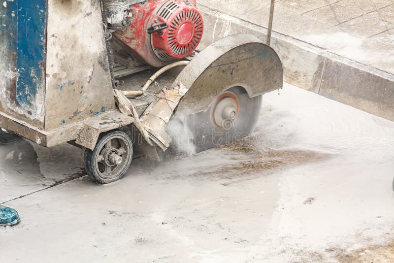 Worker Using Diamond Saw Blade Machine Cutting Concrete Road at ...
