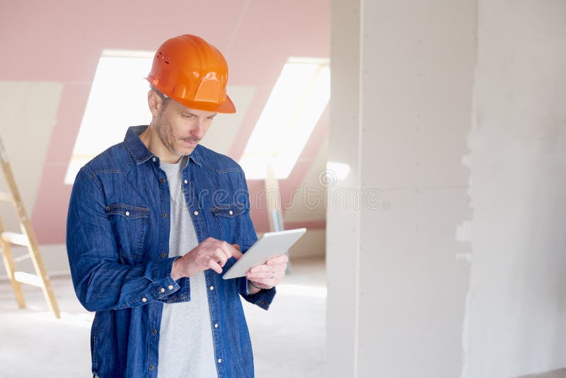 Construction Worker Using Digital Tablet while Working Stock Photo ...