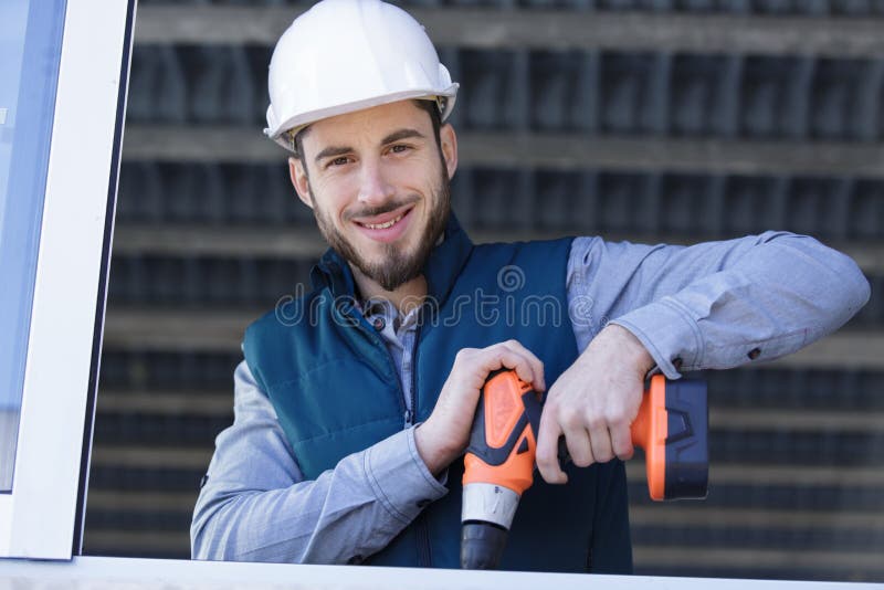 Construction Worker Using Drill To Install Window Stock Image - Image ...