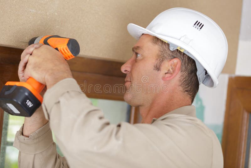 Construction Worker Using Drill To Install Window Stock Image - Image ...