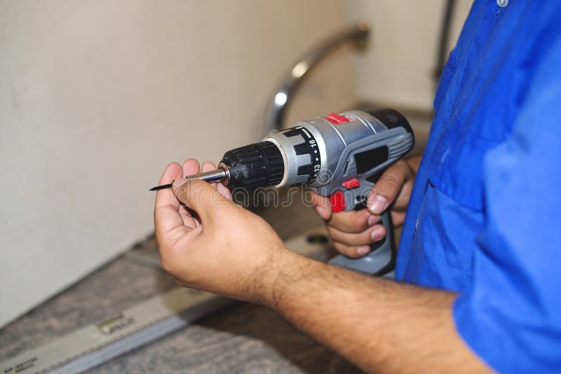 Construction Worker Using an Electric Screwdriver. Stock Image - Image ...